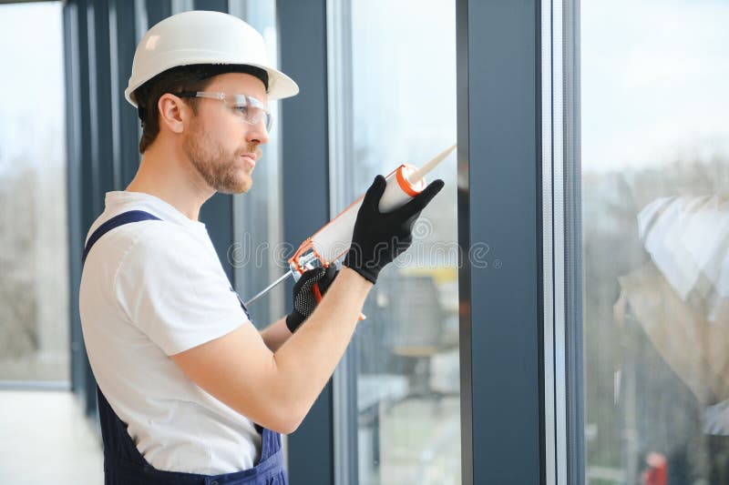 Construction Worker Installing Window in House. Stock Image - Image of ...