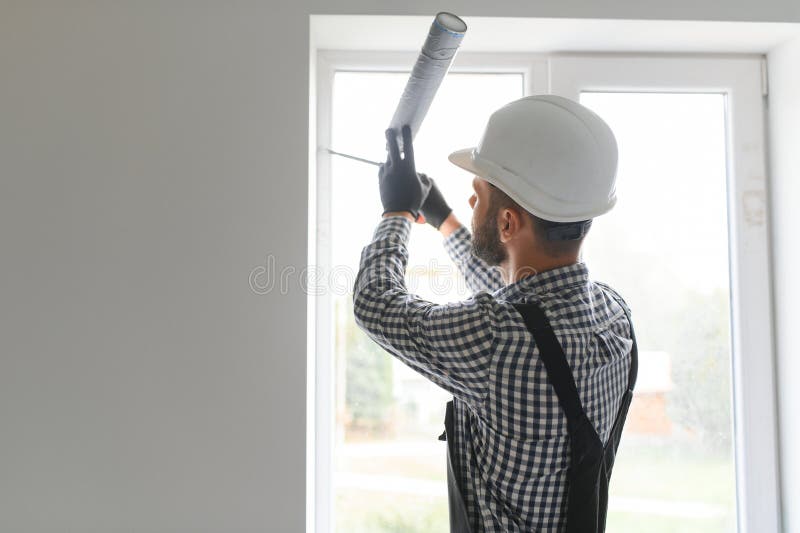 Construction Worker Installing Window in House Stock Photo - Image of ...