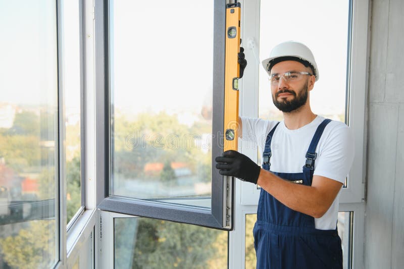 Construction Worker Installing Window in House Stock Photo - Image of ...