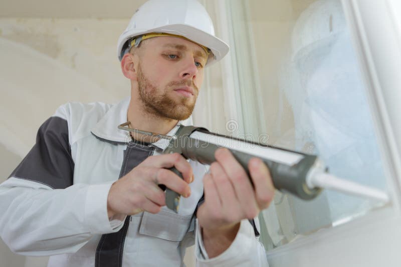 Construction Worker Installing Window in House Stock Image - Image of ...