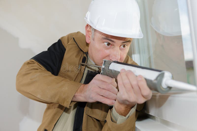 Construction Worker Installing Window in House Stock Image - Image of ...