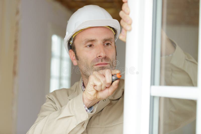 Construction Worker Installing Window in House Stock Image - Image of ... Construction Worker Installing Window in House Stock Image - Image of ...