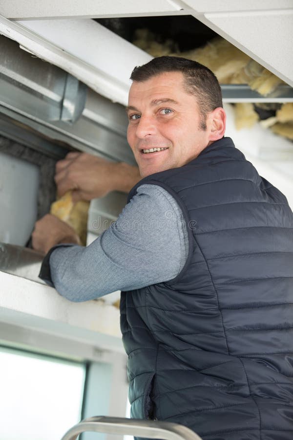 Construction Worker Insulating Plaster Wall with Glass Wool Stock Photo ...