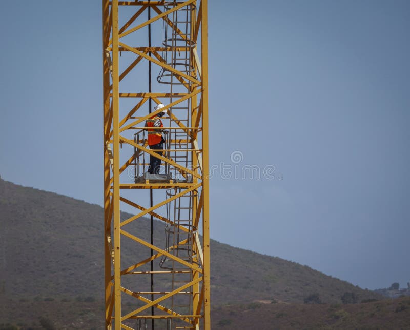 Big yellow tower crane stock image. Image of machinery - 274629083