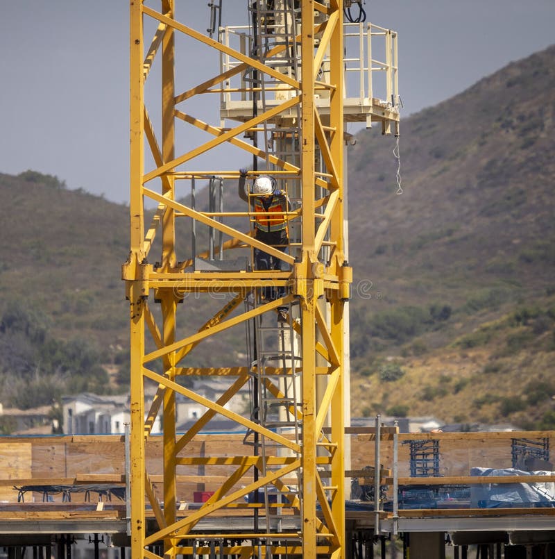 Big yellow tower crane stock image. Image of machinery - 274629083