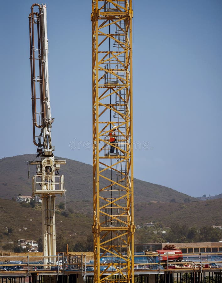 Big yellow tower crane stock image. Image of machinery - 274629083