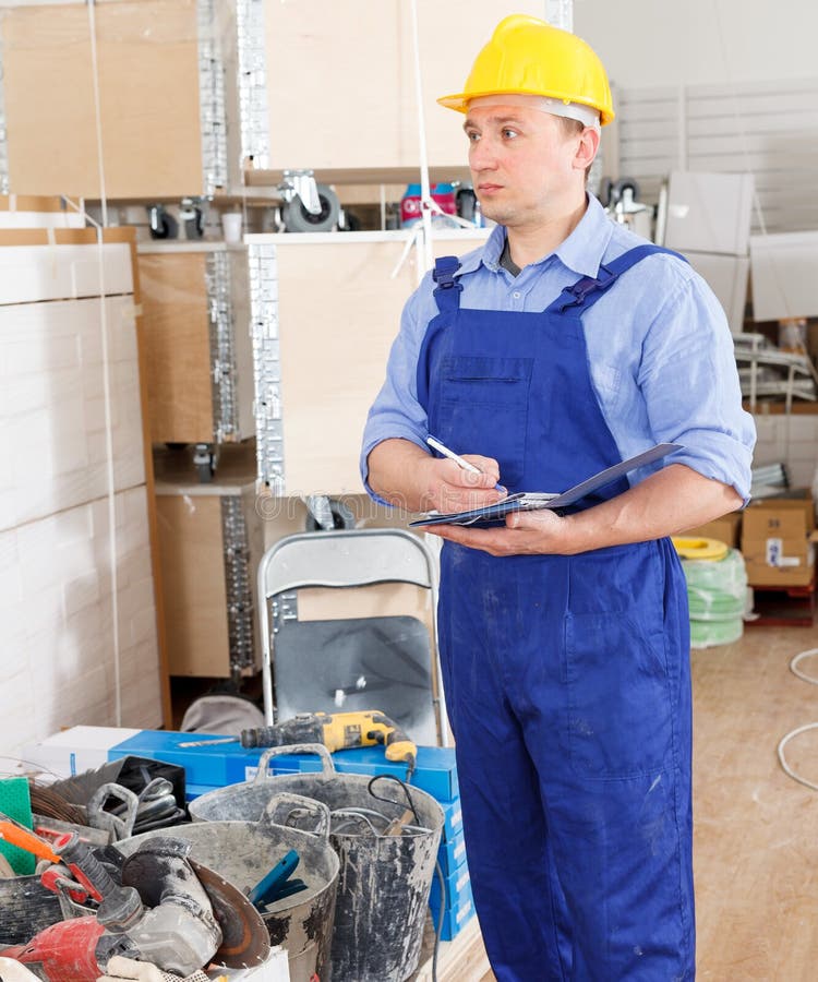 Construction Worker Inventorying Tools and Materials Stock Photo ...