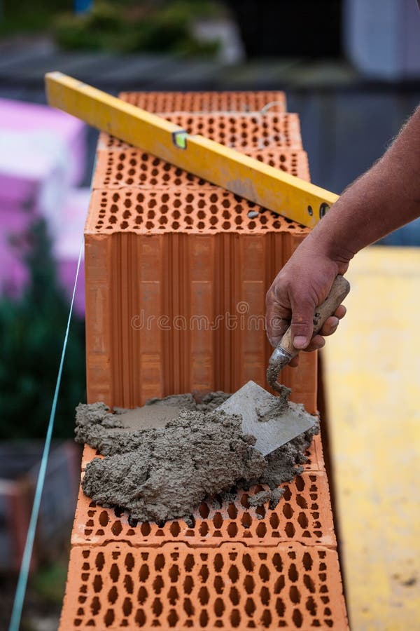 Mason with Brick on Construction Site Stock Image - Image of ...