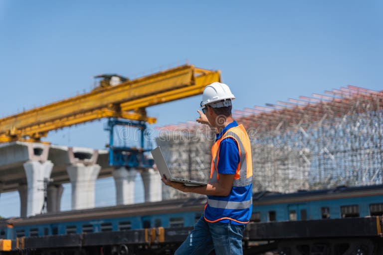 Construction Worker with Laptop on a Building Site, Railway Engineer ...