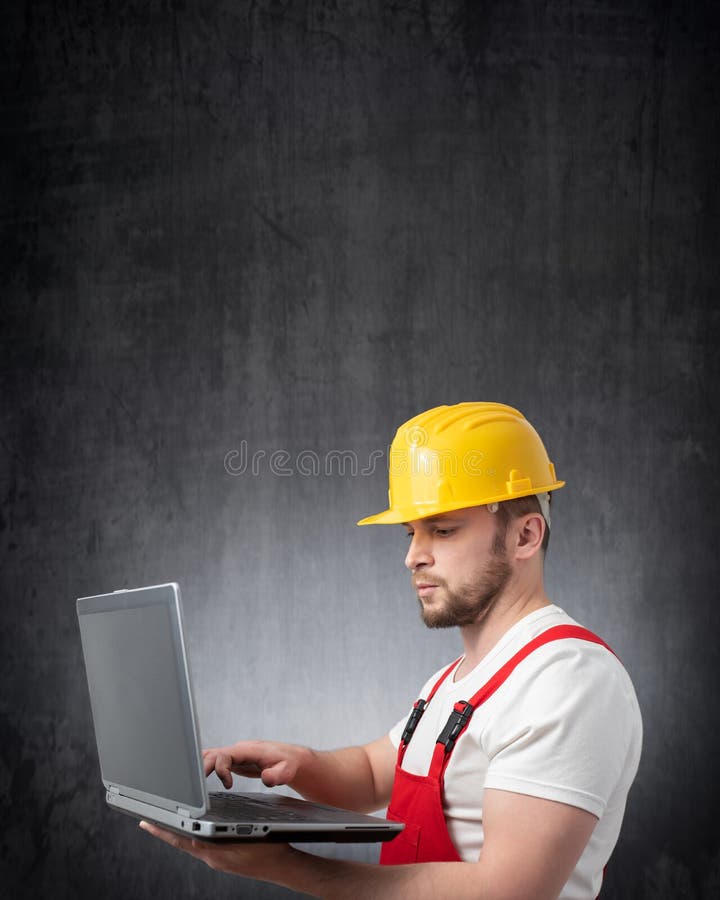 Construction Worker with a Laptop Stock Photo - Image of working ...