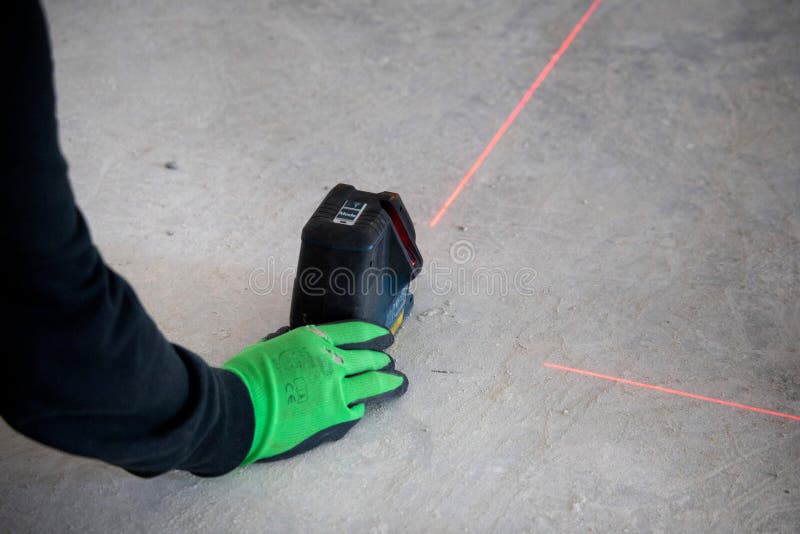 Construction Worker with Laser Device Stock Photo - Image of laser ...