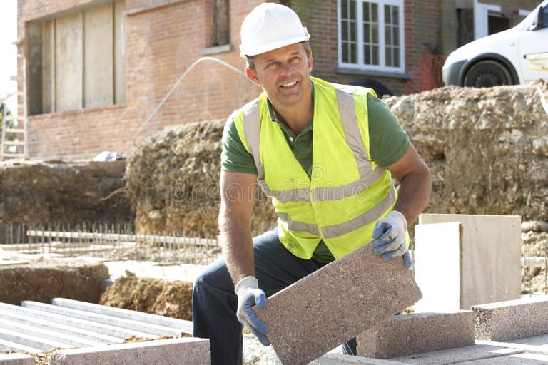 Construction Worker Laying Blockwork Stock Image - Image of middle ...