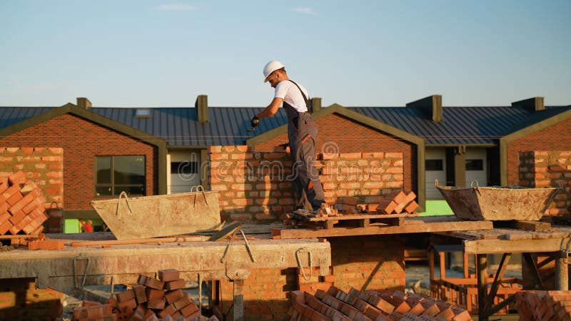 Construction Worker Laying Bricks for Modern Townhouse Stock Video ...