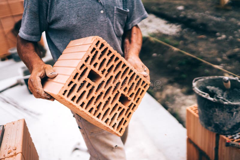 Construction Worker Laying Bricks on Walls, Carrying and Moving Around ...