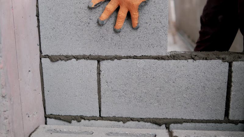 Construction Worker Laying Concrete Blocks, Building Wall Stock Footage ...