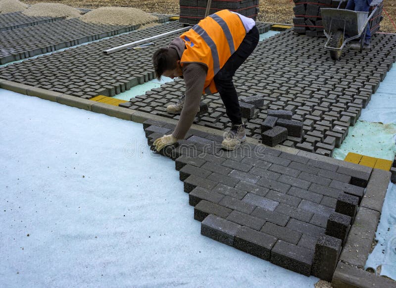 Construction Worker Laying Interlocking Paving Concrete Stock Image ...