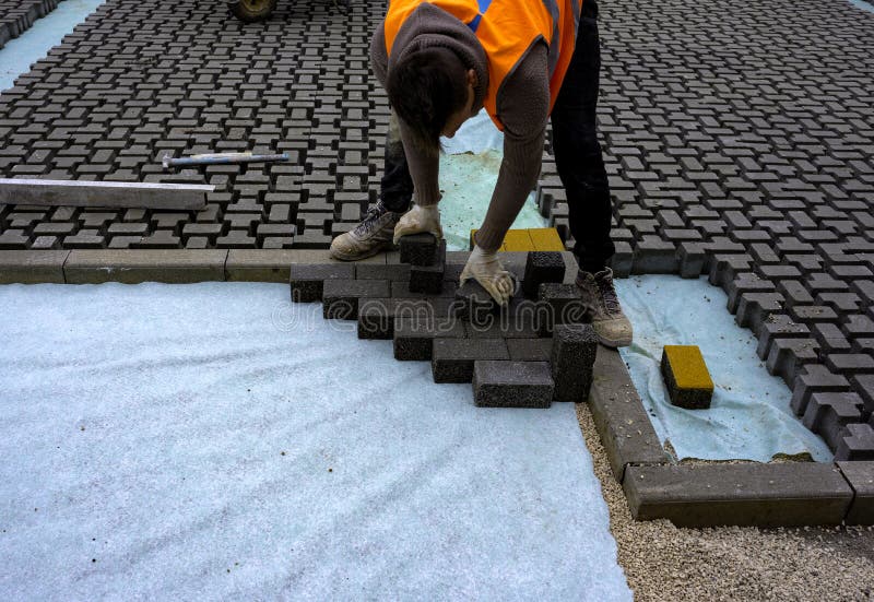 Construction Worker Laying Interlocking Paving Concrete Stock Photo ...
