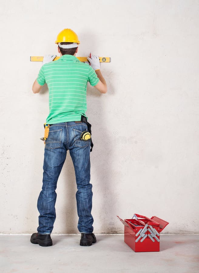 Construction Worker with Level Tool Stock Photo - Image of level, floor ...