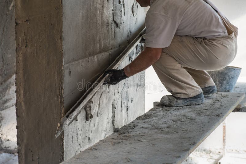 Construction Worker Leveling the Wall Stock Photo - Image of home ...