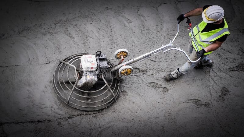 Troweling Fresh Concrete on a Garage Foundation with a Trowel Left on ...