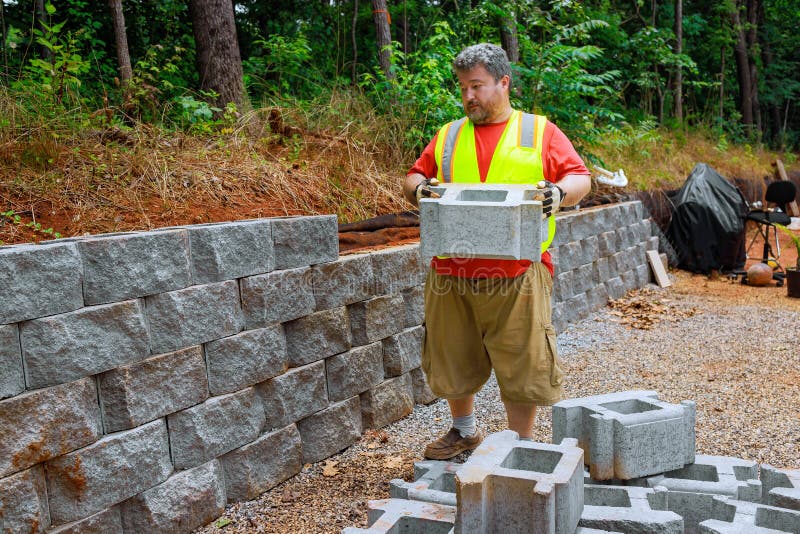 Construction Worker Lifted Concrete Block from Ground and Placed it on ...