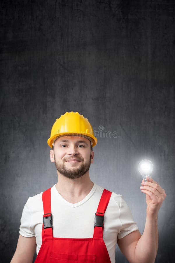 Construction Worker with a Light Bulb Stock Photo - Image of occupation ...