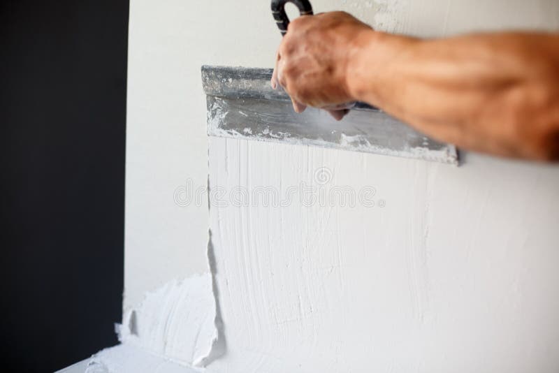 Construction Worker with Long Trowel Plastering a Wall. Stock Photo ...