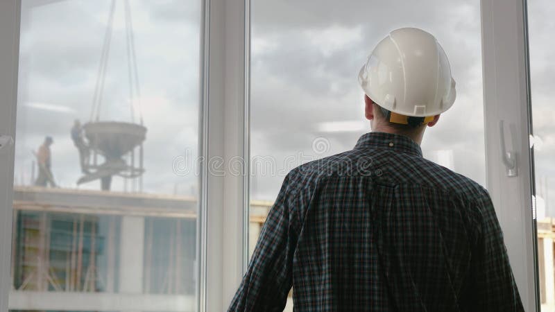 A Construction Worker Looking at Construction Works. Stock Photo ...