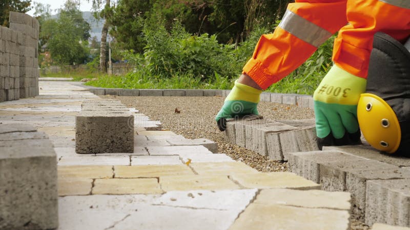 Construction Worker Makes New Sidewalk Pavement with Stone Bricks Stock ...