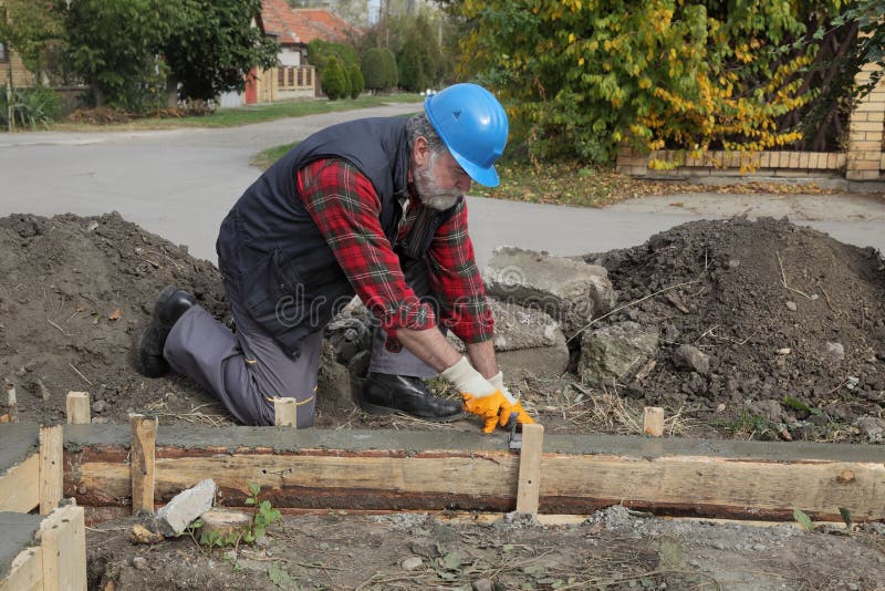 Construction Worker Making Concrete Foundation in Formwork Stock Image ...