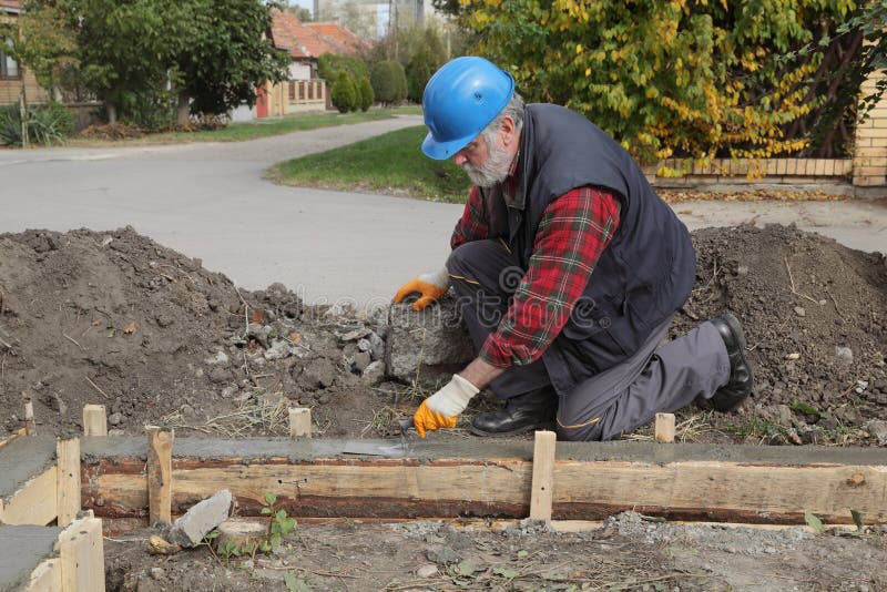 Construction Worker Making Concrete Foundation in Formwork Stock Image ...