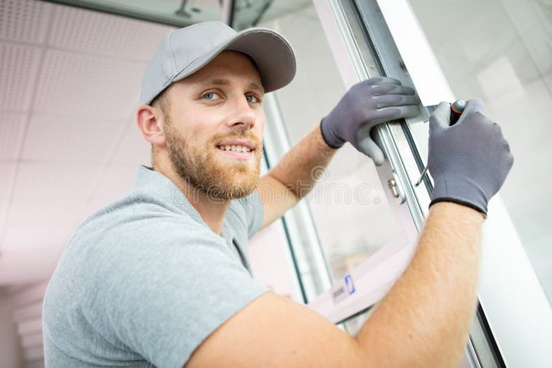 Construction Worker Man Uses Screwdriver To Handle Stock Photo - Image ...