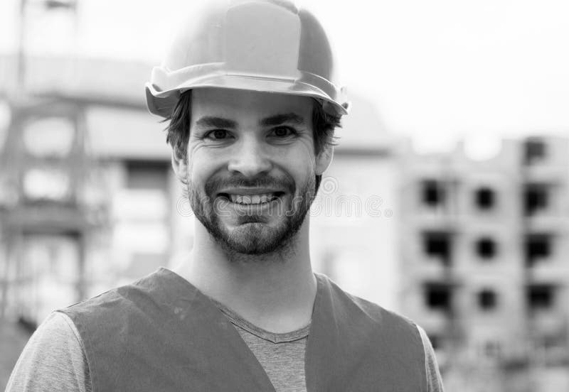 Construction Worker Man in Work Clothes and a Construction Helmet ...