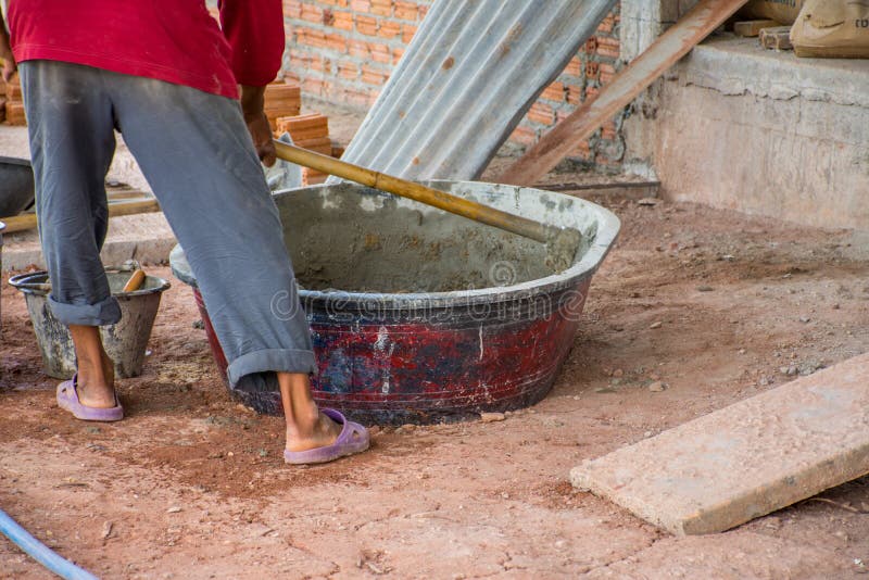 Construction Worker Manually Mixing Concrete in Mixer Tray Stock Photo ...