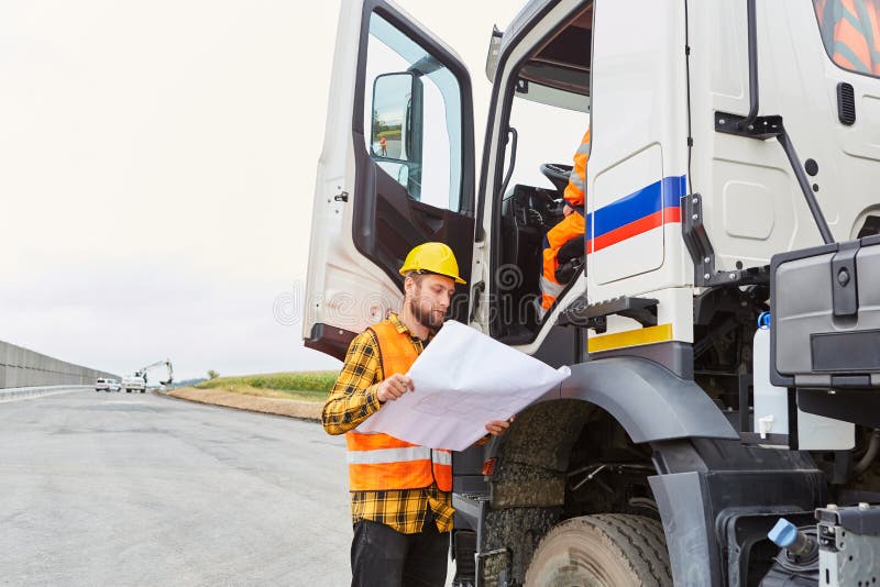 Construction Worker with a Map in Front of a Truck Stock Photo - Image ...
