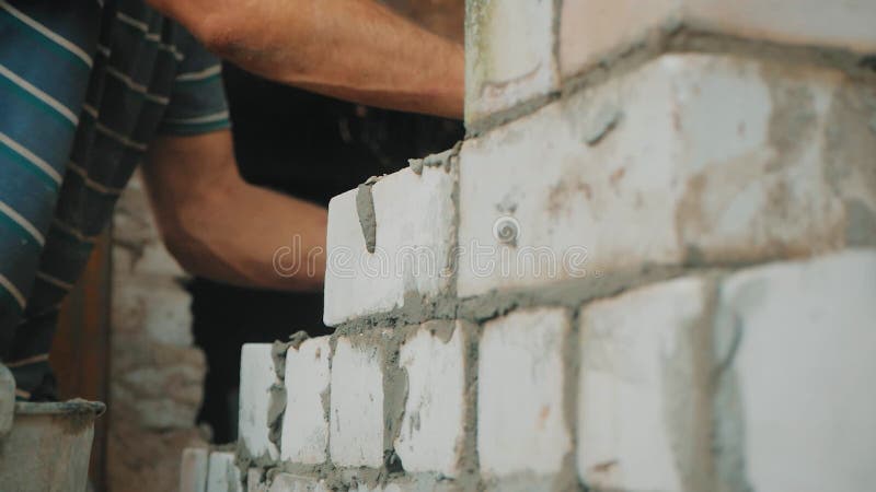 Construction Worker or Mason Laying Bricks and Creating Walls ...