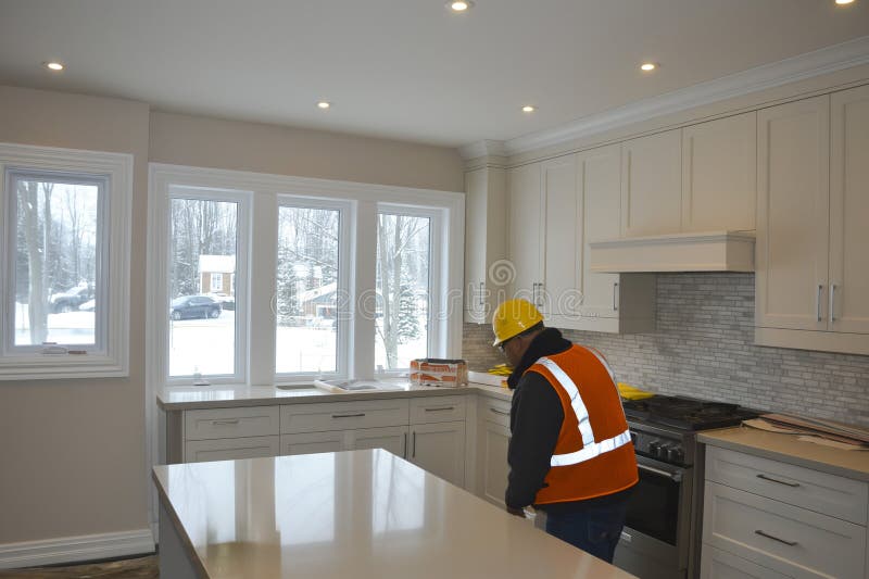A Construction Worker Mason in the Ongoing Remodeling of a Spacious ...