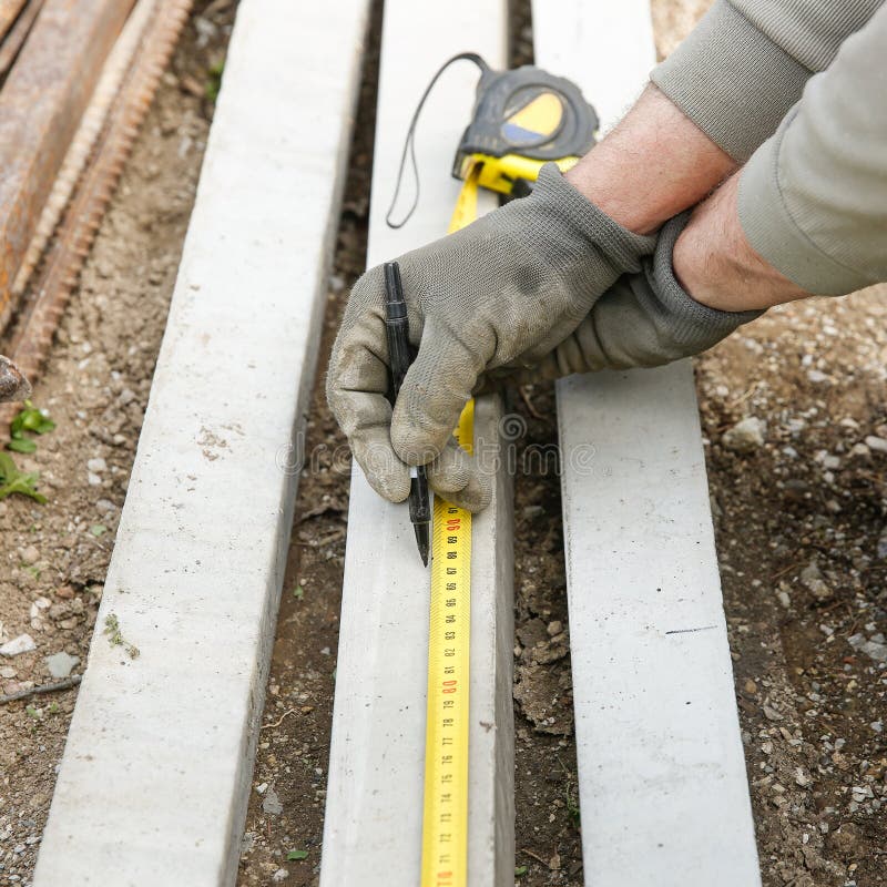 Construction Worker Measuring Concrete Pillar Stock Image - Image of ...
