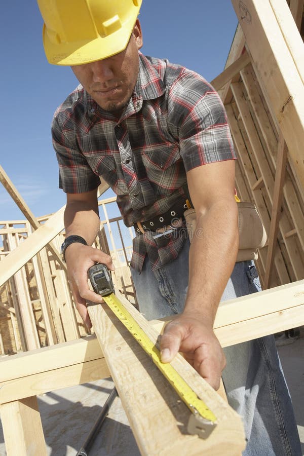 Construction Worker Hammering Nail on Timber Frame Stock Photo - Image ...