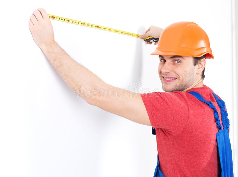 Construction Worker Measuring the Wall Stock Image - Image of meter ...