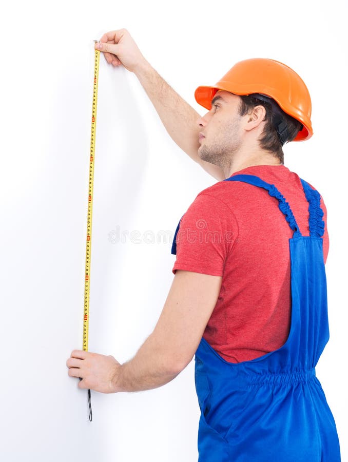 Construction Worker Measuring the Wall Stock Image - Image of ...