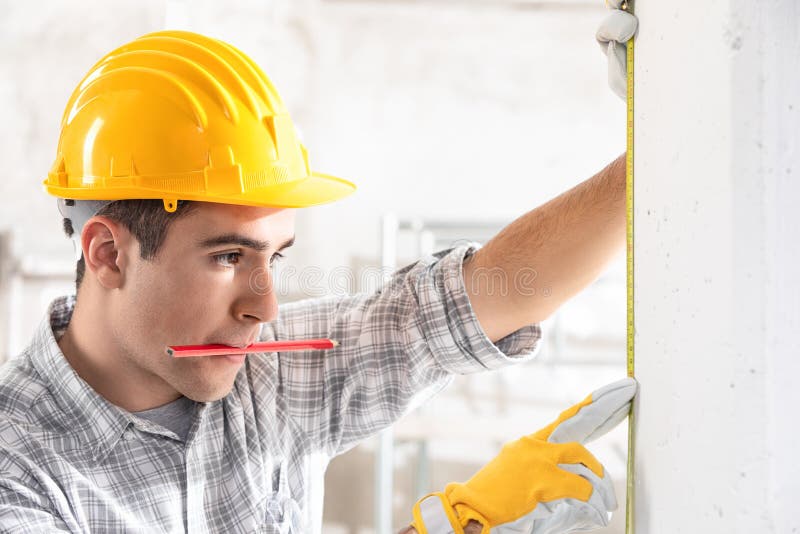 Construction Worker Measuring the Wall Stock Image - Image of ...