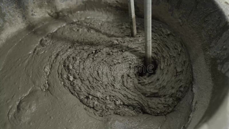 Construction Worker Mixing Cement at Building Site. Stock Footage ...
