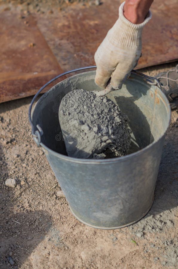 Construction Worker Mixing Concrete Cement and Sand by Spade Stock ...