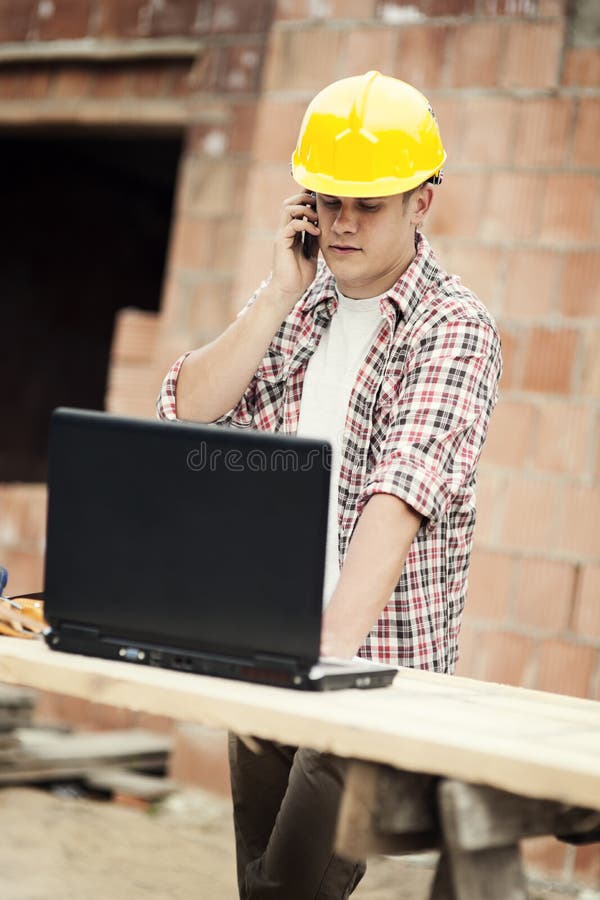 Construction Worker with Mobile Phone Stock Photo - Image of housing ...