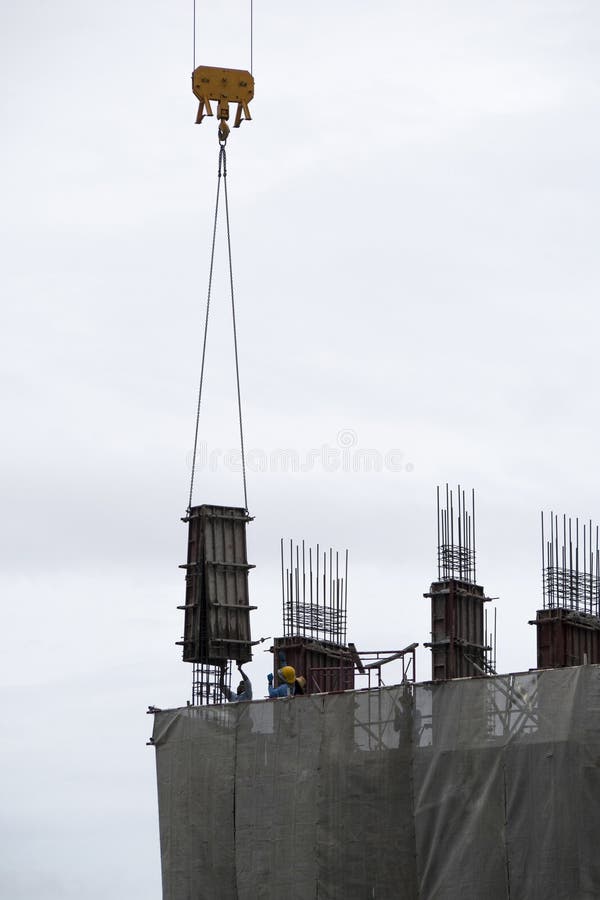 Construction Worker Mounting Concrete Formwork with Crane during Stock ...
