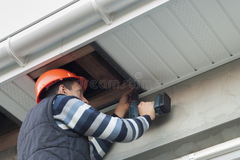 Installation of soffits stock photo. Image of hand, installation ...