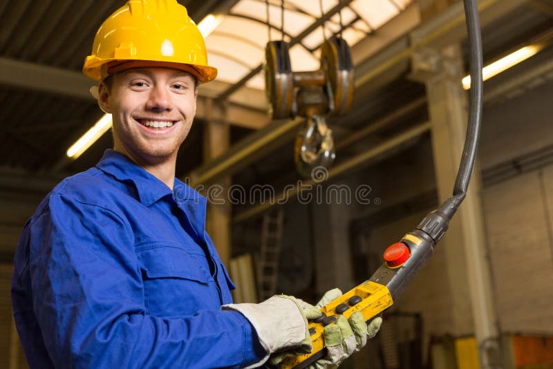 Construction Worker Operating Crane in Assembly Hall Stock Photo ...