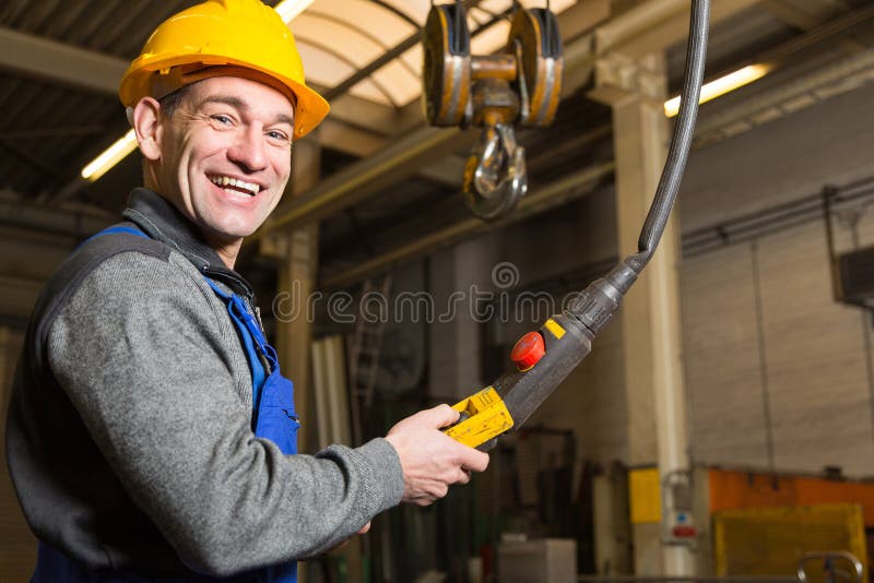 Construction Worker Operating Crane in Assembly Hall Stock Image ...