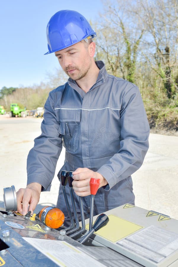 Construction Worker Operating Machine Stock Image - Image of building ...